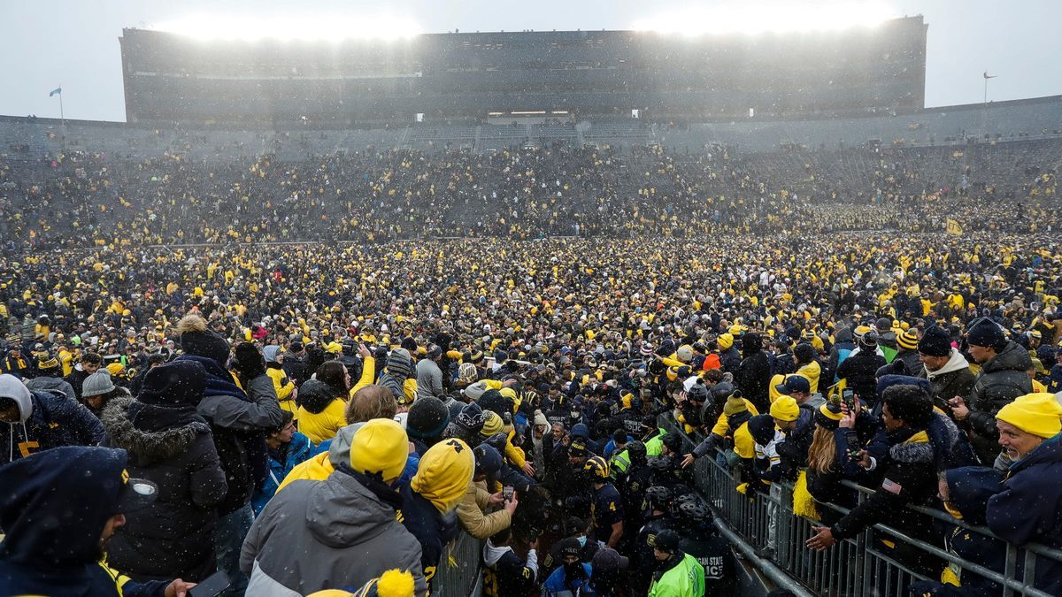 Scenes From Michigan's Snowy Win Vs. Ohio Sate As Fans Rush Field